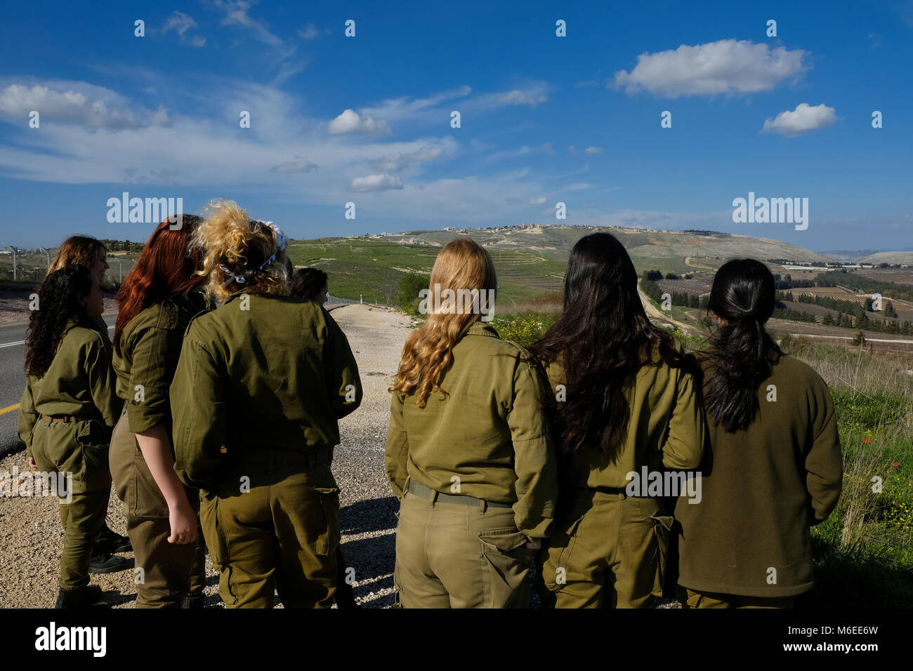 A group of Israeli female soldiers gazing toward southern Lebanon from ...