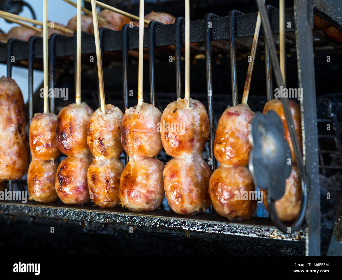 Thai sausage (Sai Krok Isan), made from mince pork, rice. Mix all ...
