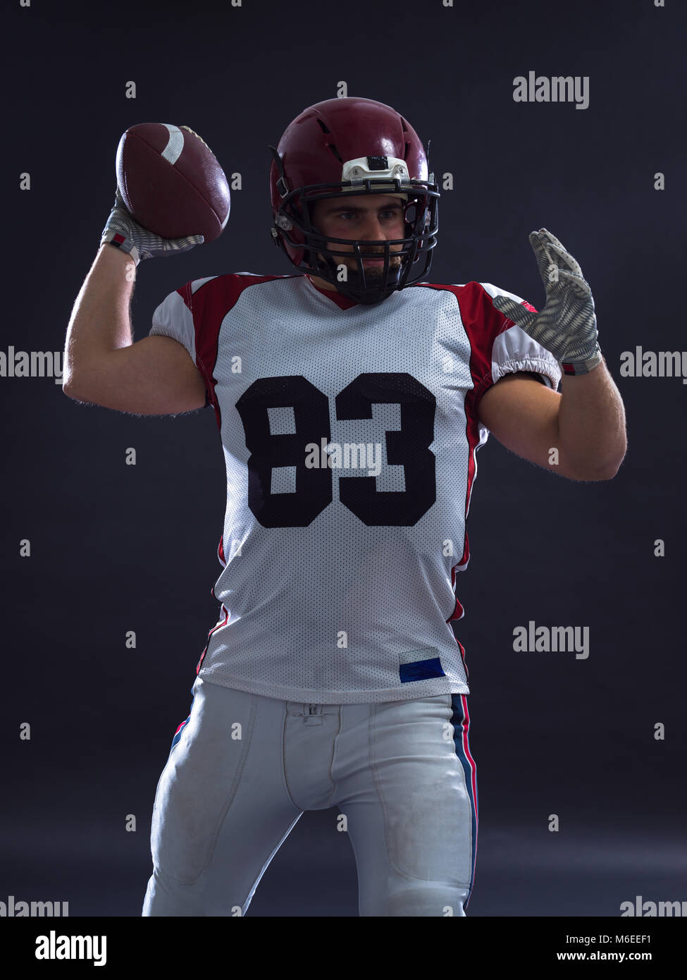 one quarterback american football player throwing ball isolated on gray ...