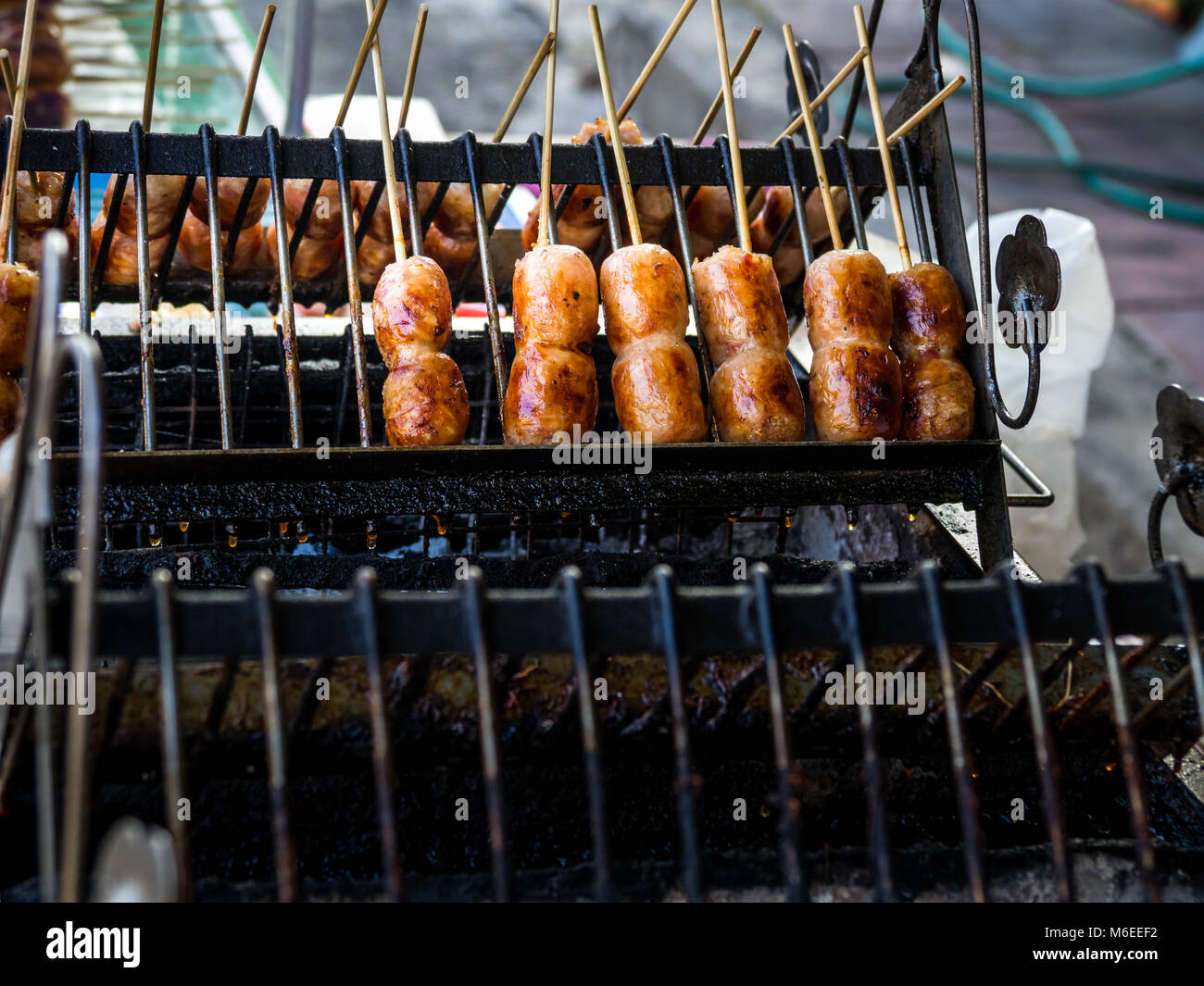 Thai sausage (Sai Krok Isan), made from mince pork, rice. Mix all ...