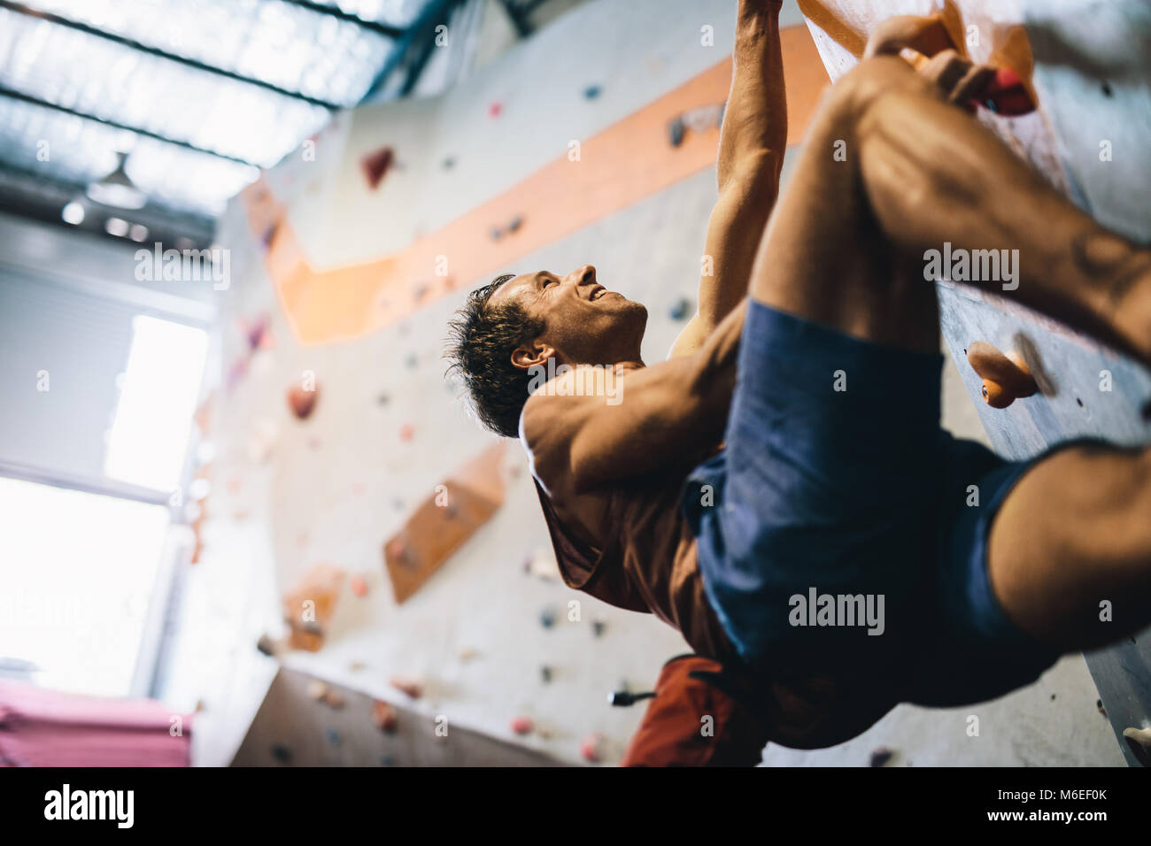 Man indoor rock climbing hi-res stock photography and images - Alamy