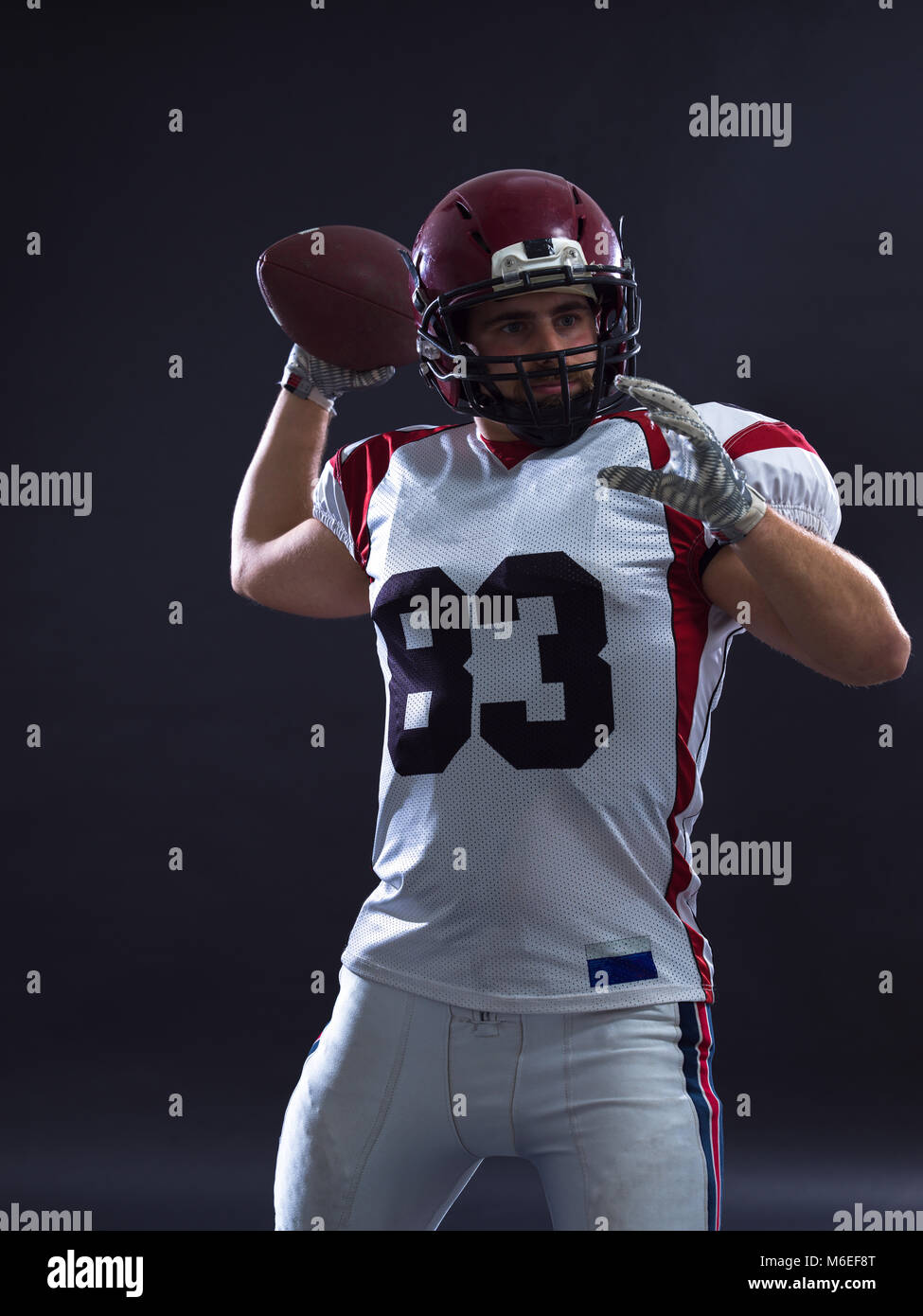 one quarterback american football player throwing ball isolated on gray ...