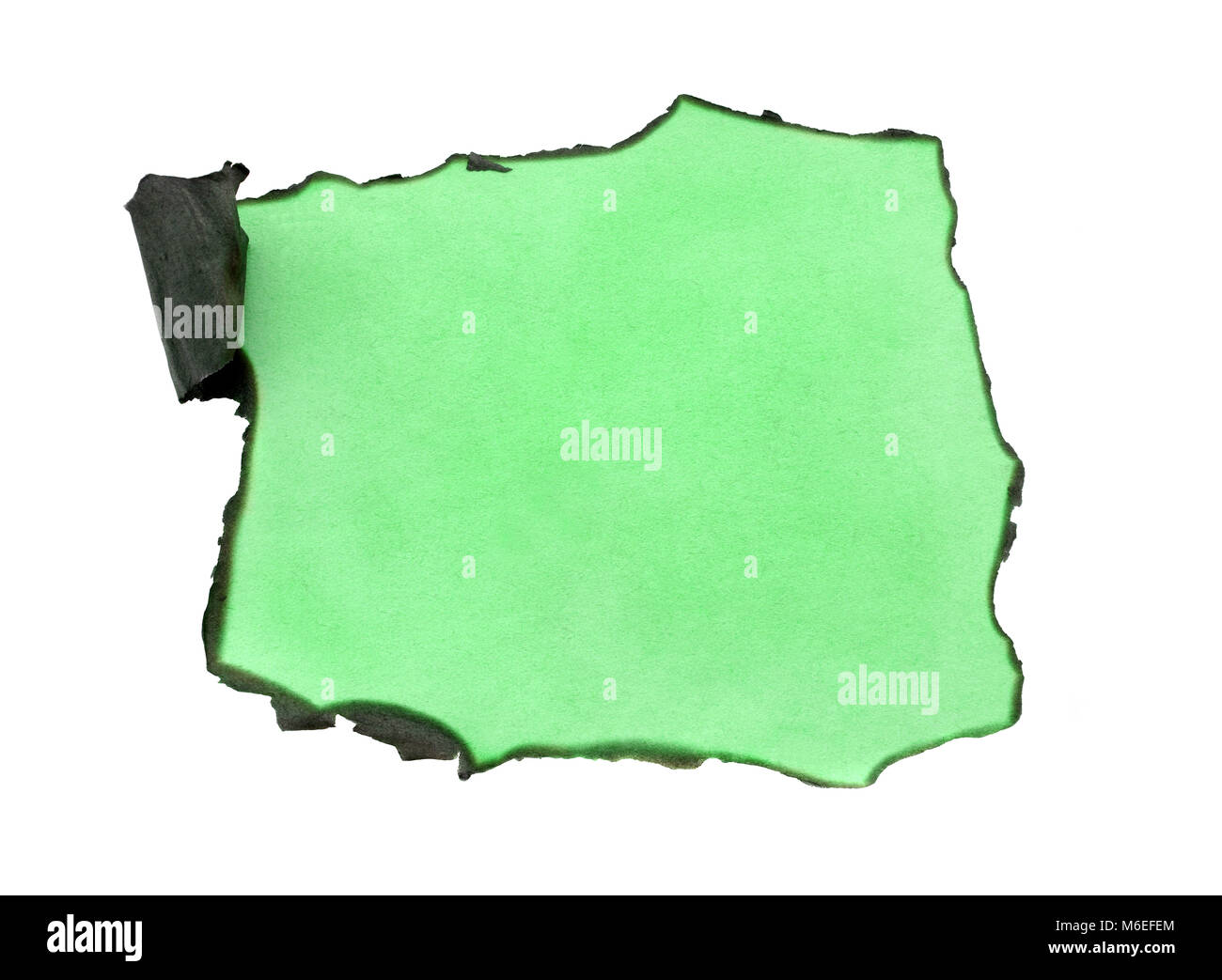 green burned paper on edge isolated on white background Stock Photo - Alamy