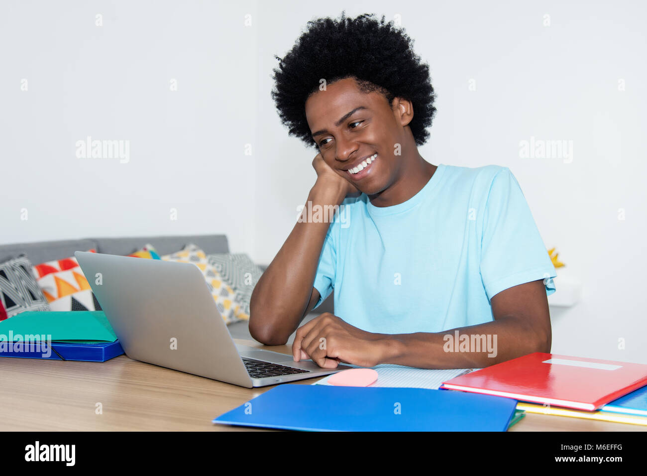African american student laptop home hi-res stock photography and ...