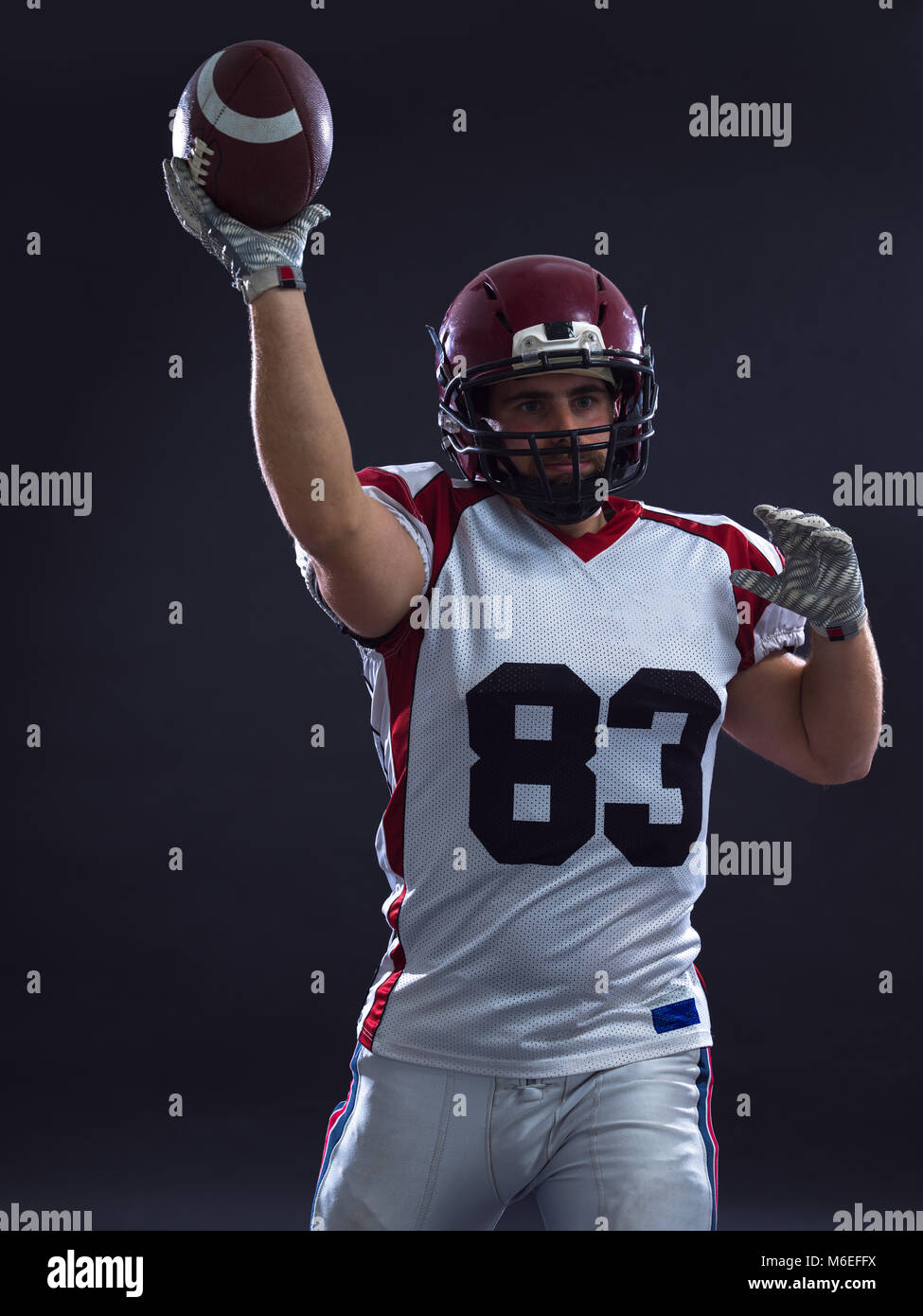 one quarterback american football player throwing ball isolated on gray ...