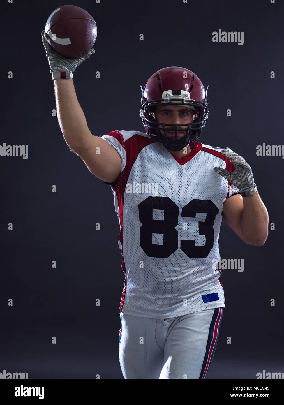 one quarterback american football player throwing ball isolated on gray ...