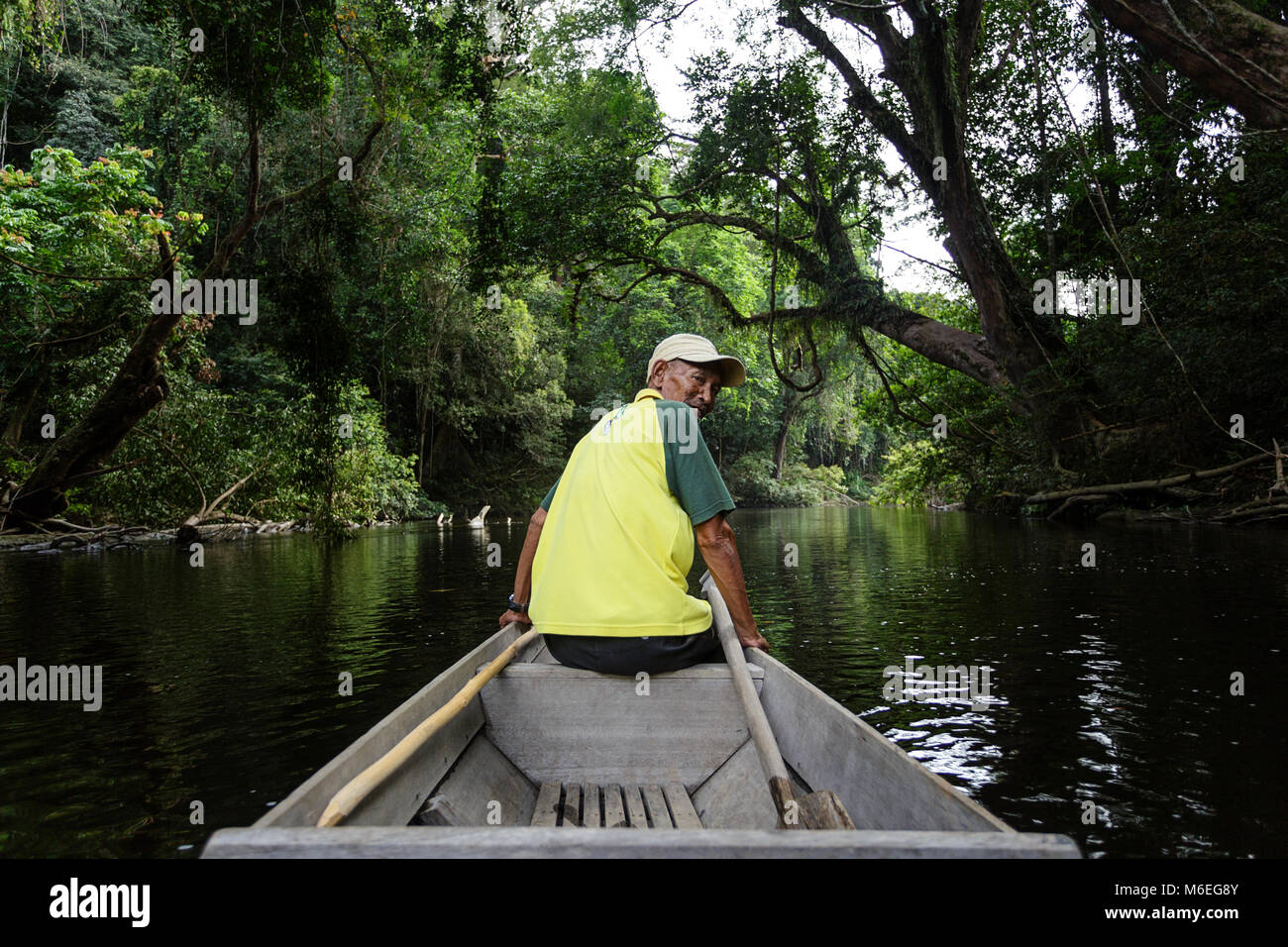 Old man rowing in traditional wooden boat on the river in the oldest ...