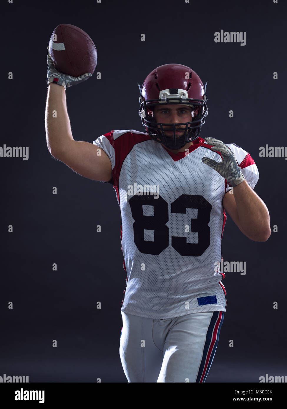 one quarterback american football player throwing ball isolated on gray ...