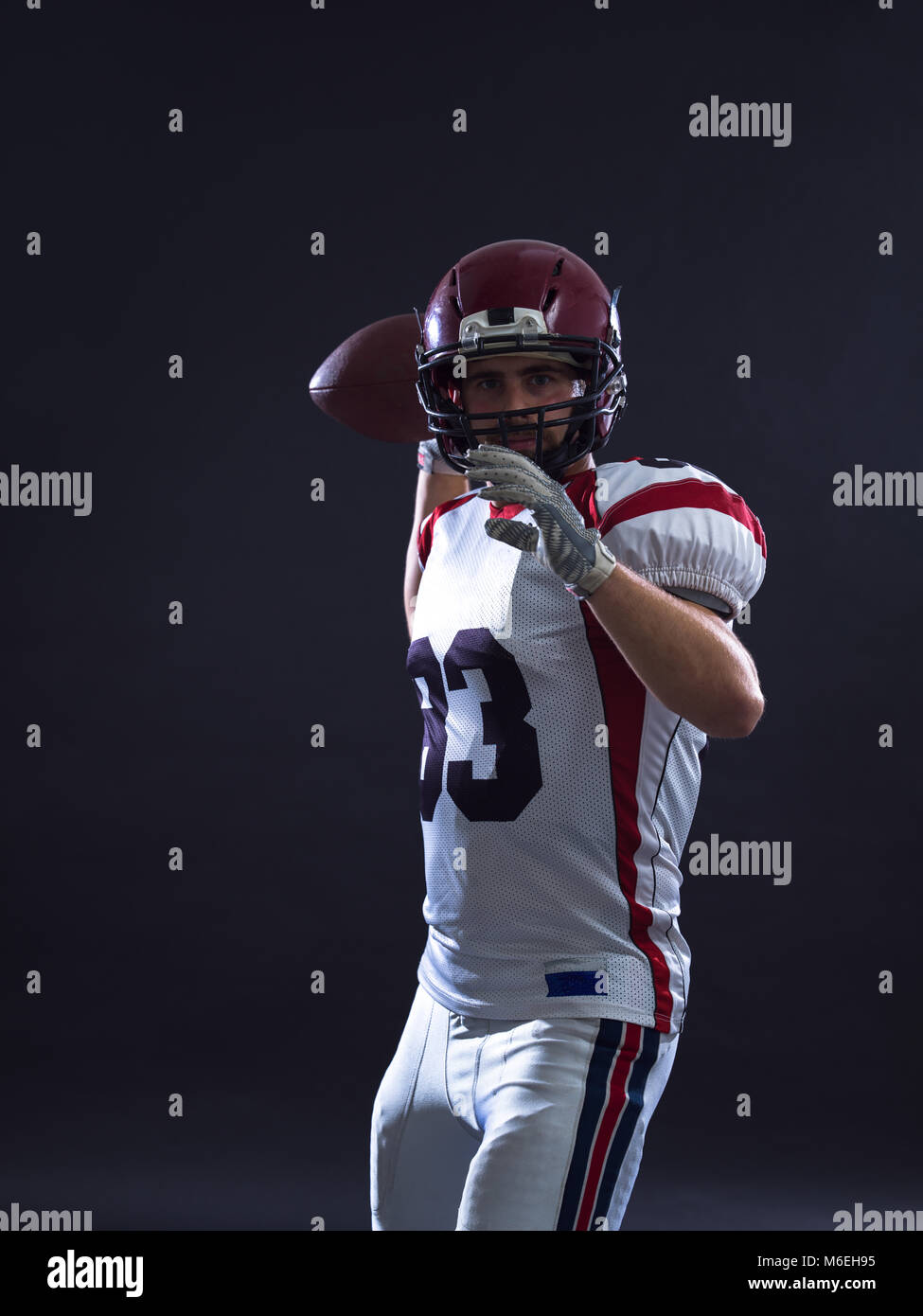 one quarterback american football player throwing ball isolated on gray ...