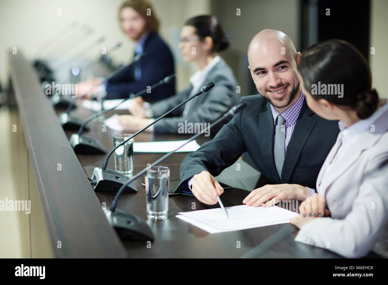 Talking at conference Stock Photo - Alamy