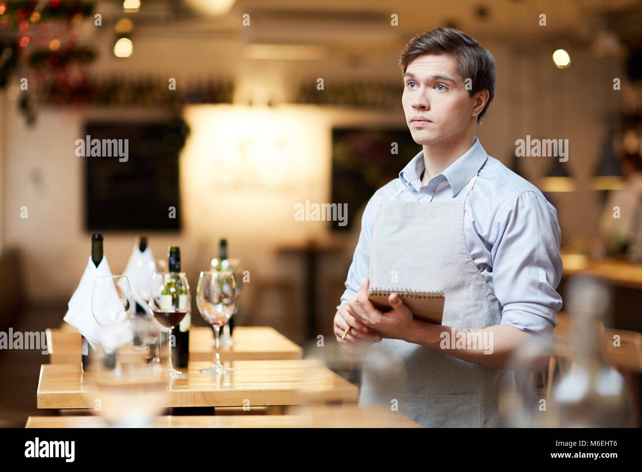 Waiter at restaurant Stock Photo - Alamy