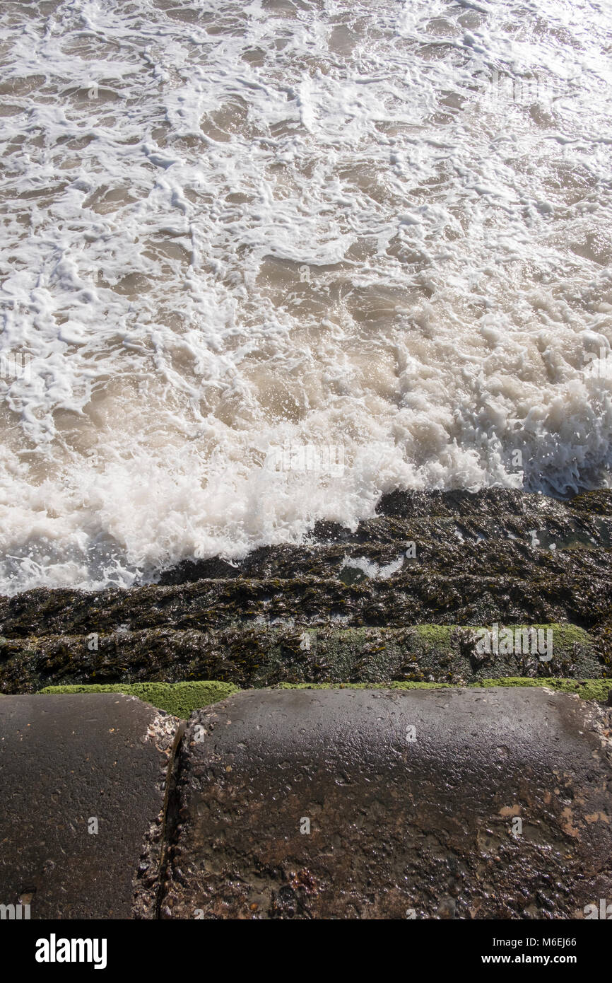 The high tide on the waterfront path near Broadstairs with the sea ...