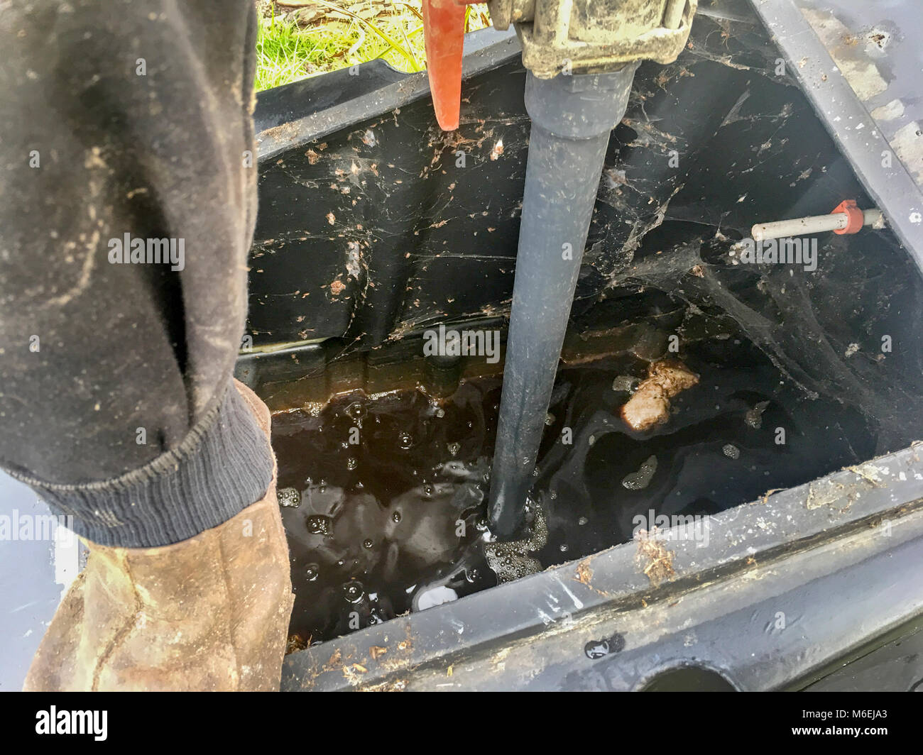 A service engineer from the composting toilet maintenance company ETS ...