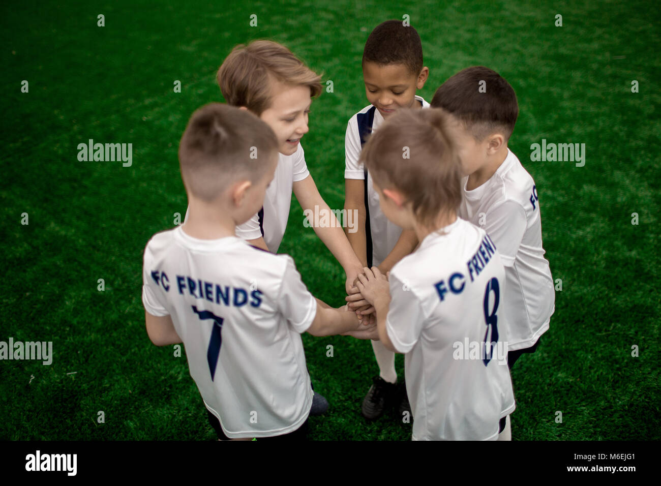 Making pile of hands Stock Photo - Alamy