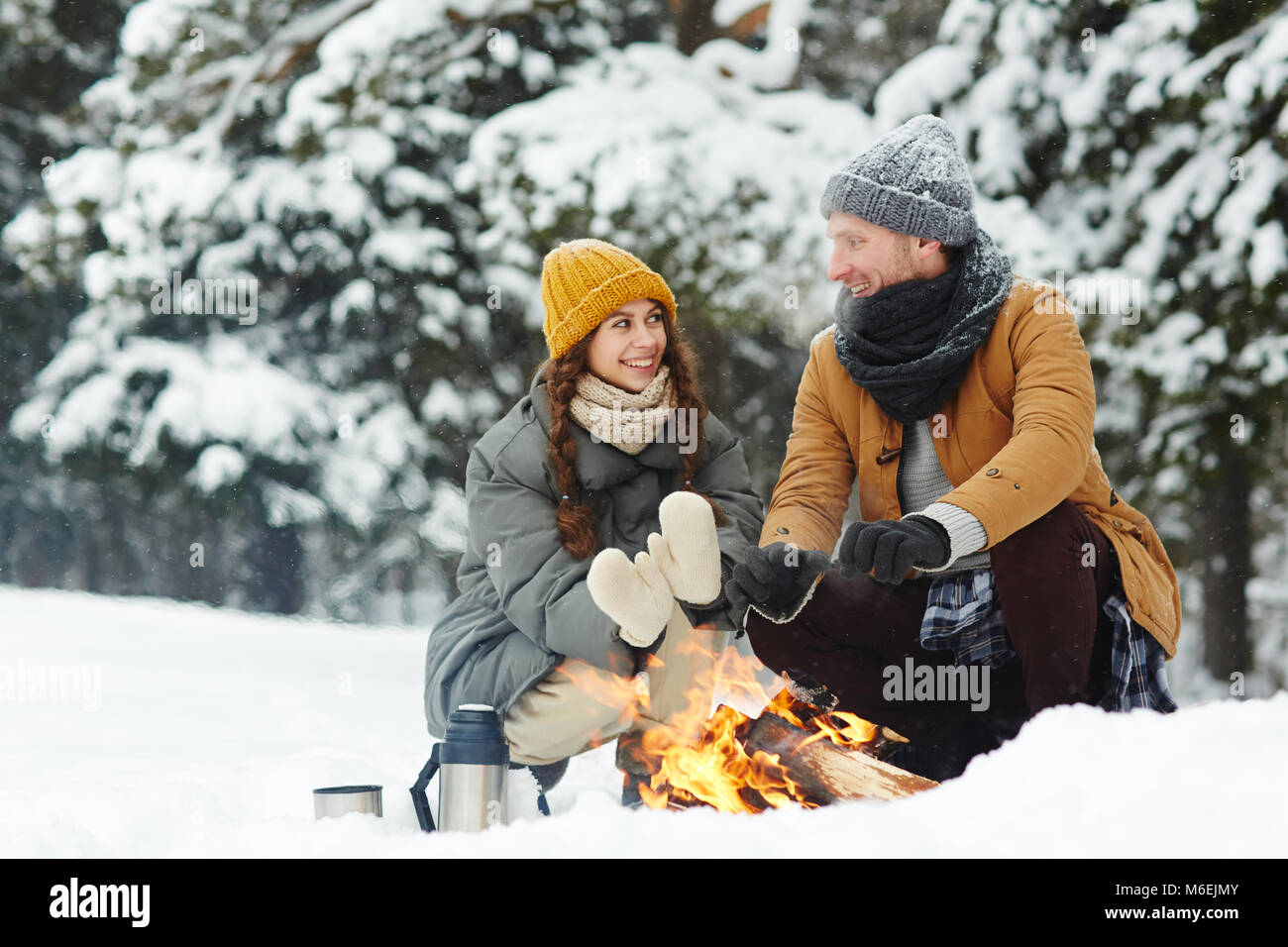 Man getting warm by the fire hi-res stock photography and images - Alamy
