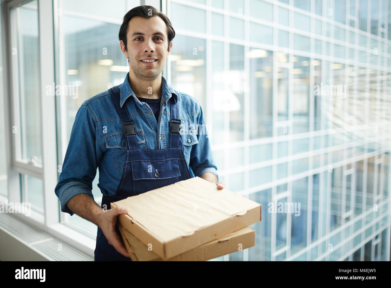 Happy delivery service employee hi-res stock photography and images - Alamy