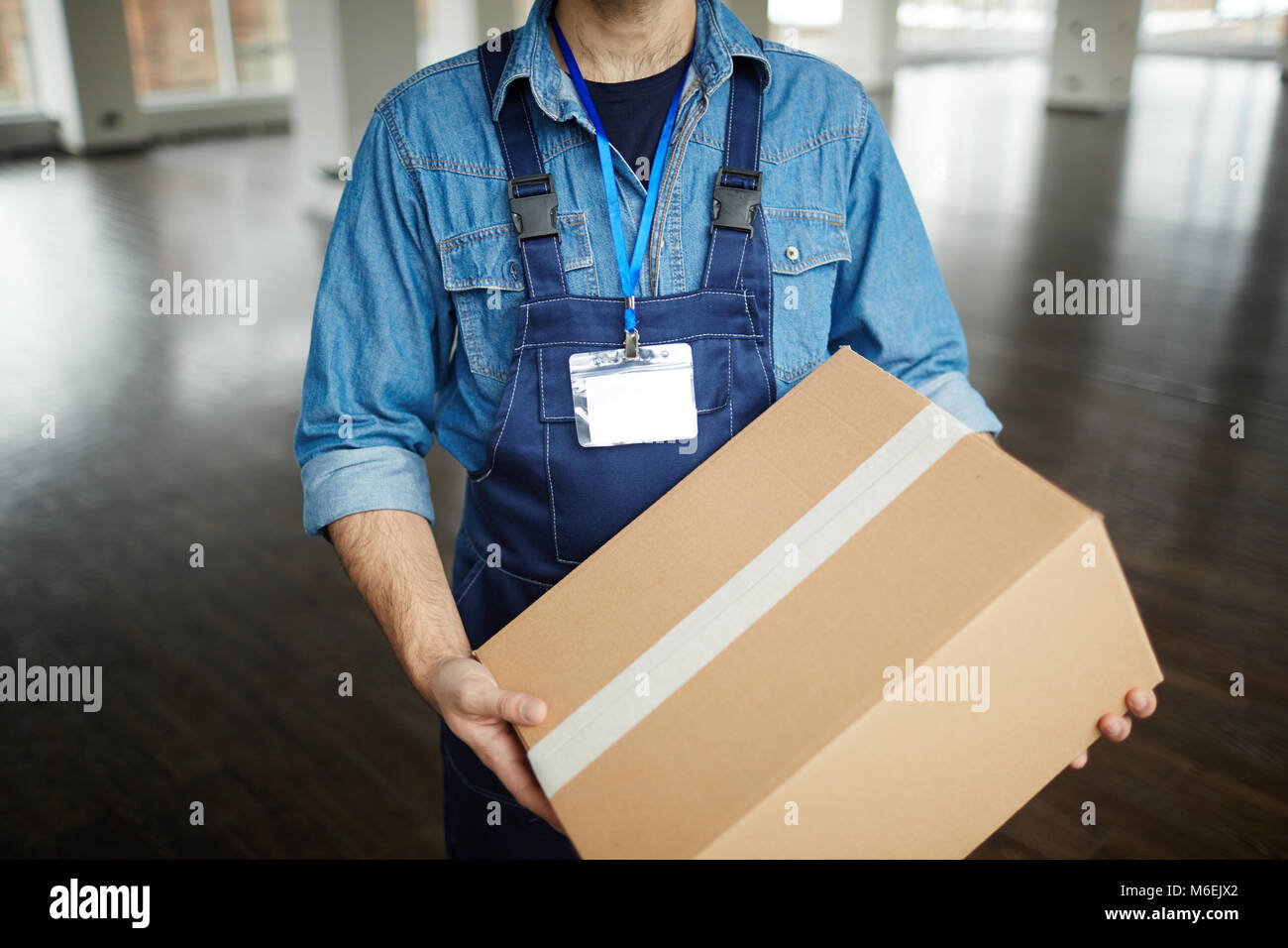 Delivery service worker Stock Photo - Alamy