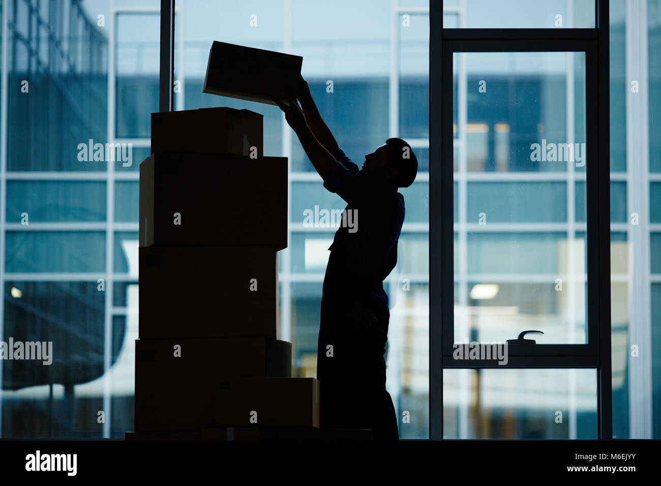 Making stack of boxes Stock Photo - Alamy