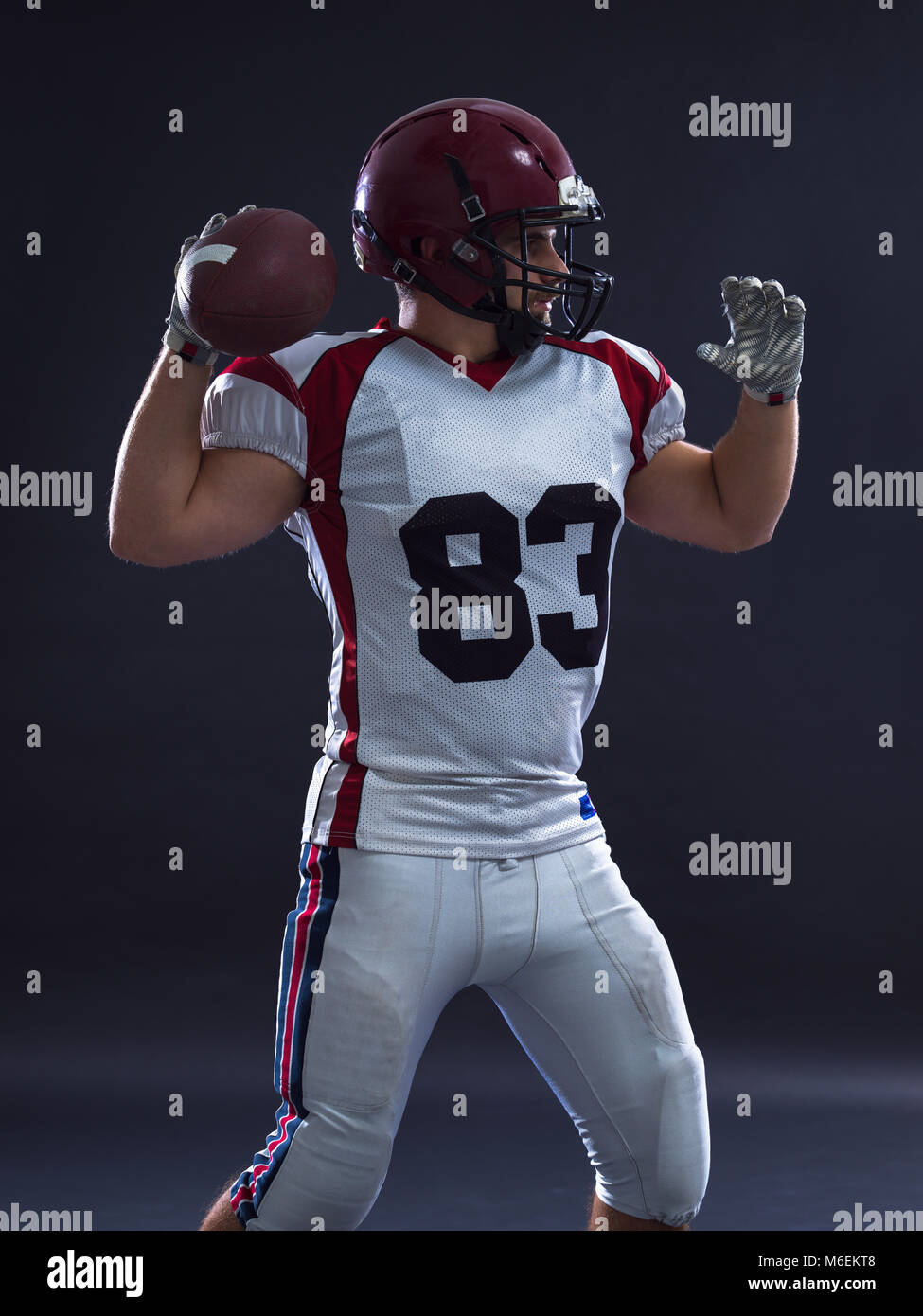 one quarterback american football player throwing ball isolated on gray ...
