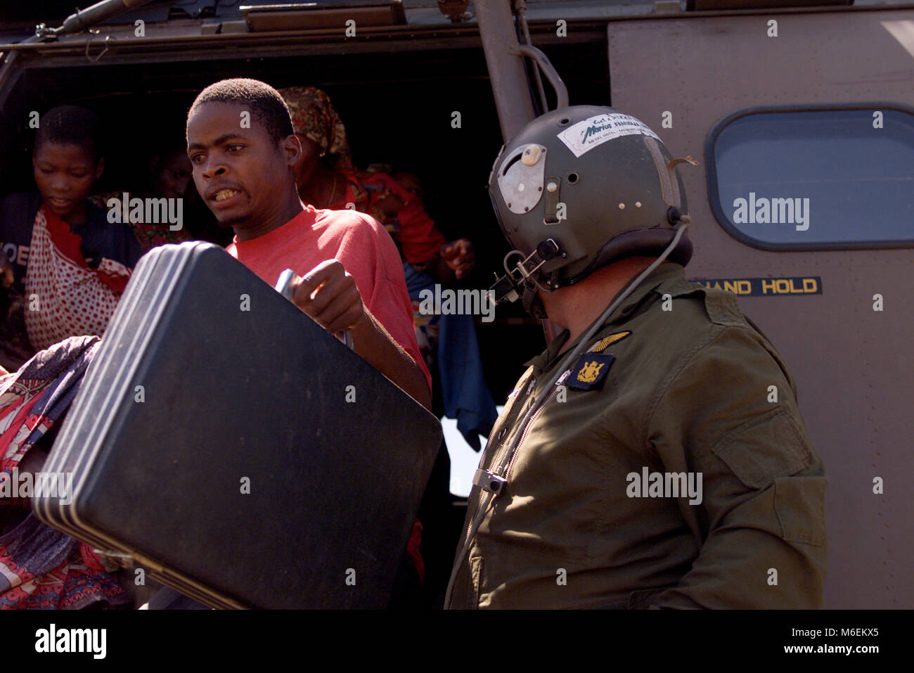 Floods in Mozambique, March 2000; Rescued people run to safety after a ...