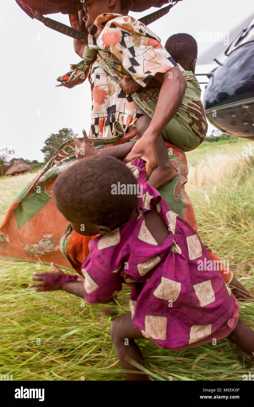 Floods in Mozambique, March 2000; Rescued people run to safety after a ...