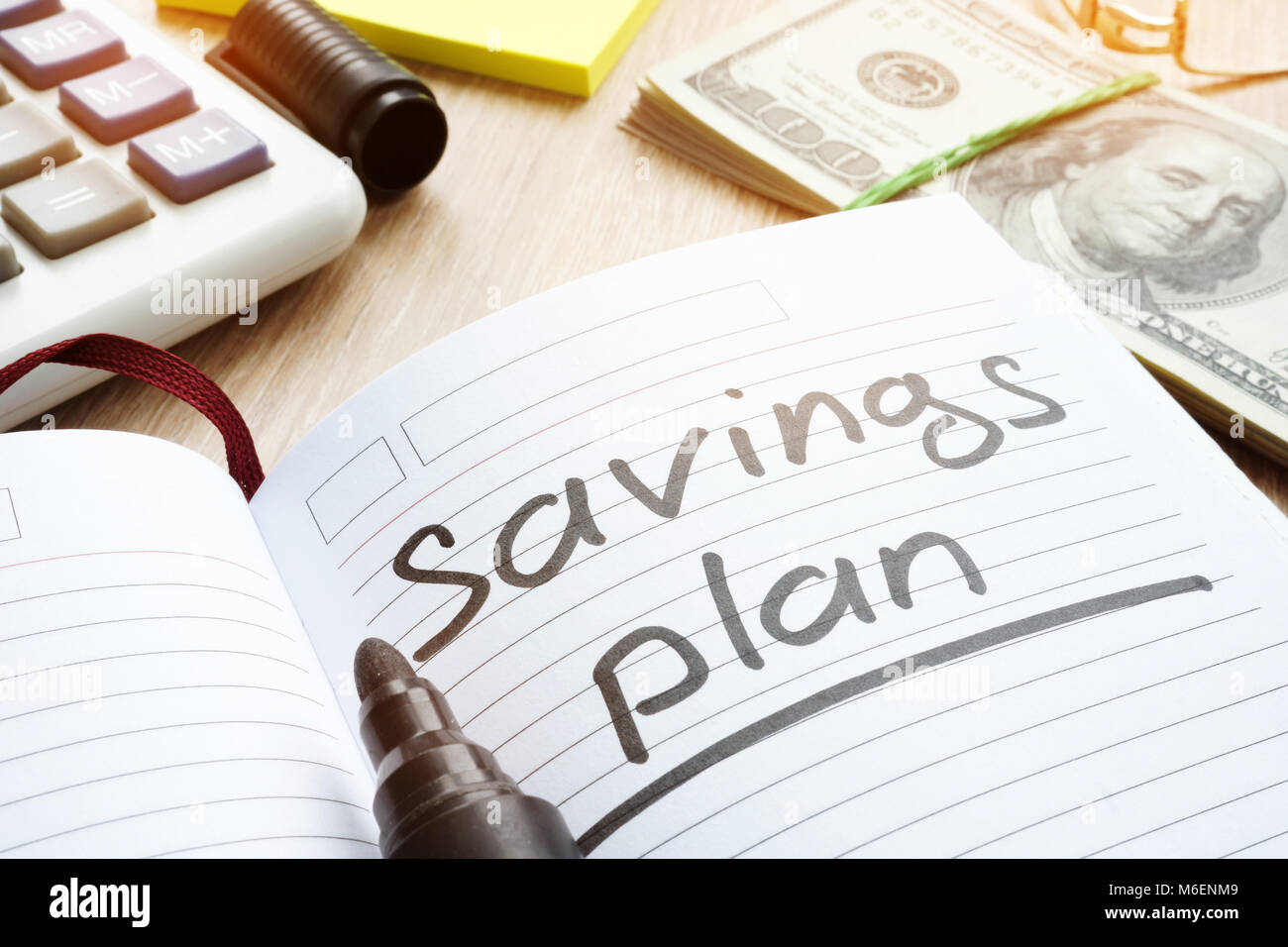 Note with words savings plan and money Stock Photo - Alamy
