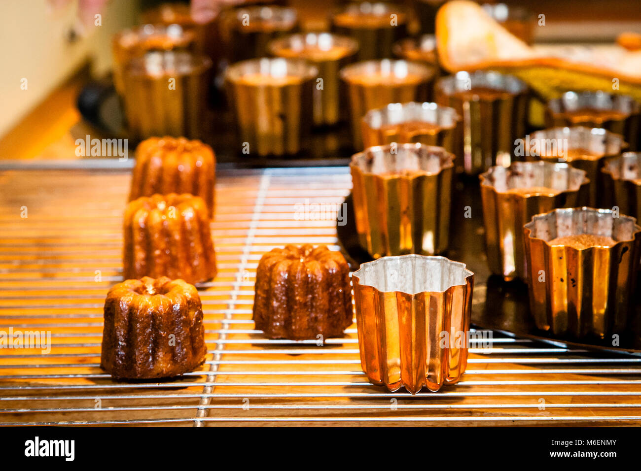 French Pastry Canneles. Preparation of a Breton specialty Stock Photo ...