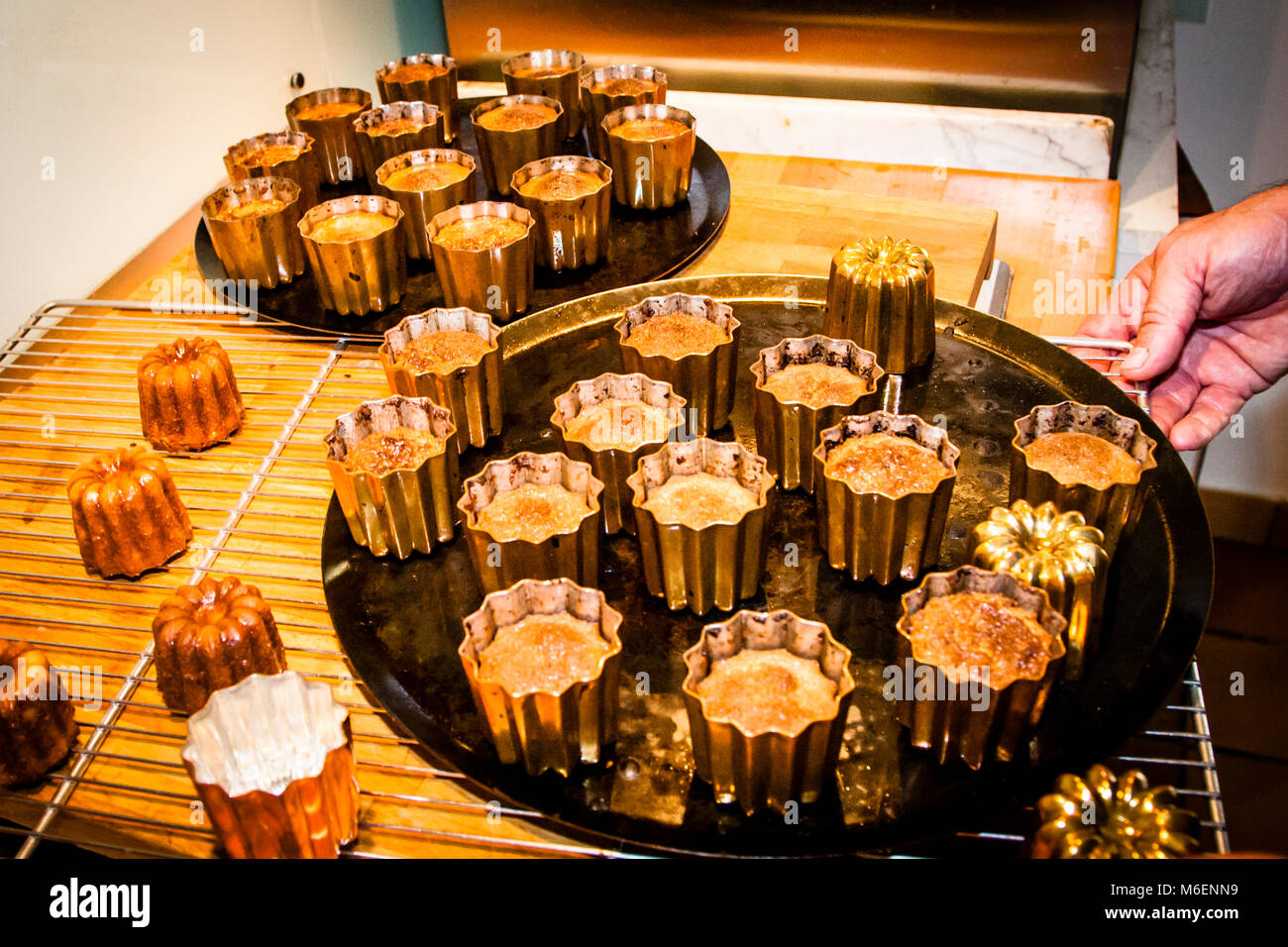 French Pastry Canneles. Preparation of a Breton specialty Stock Photo ...