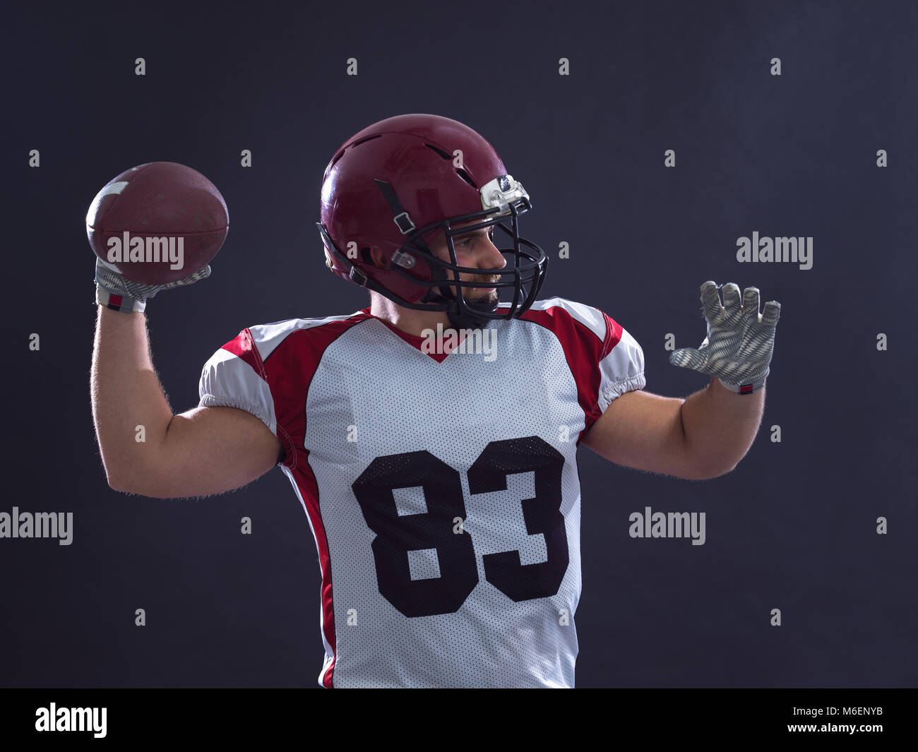 one quarterback american football player throwing ball isolated on gray ...