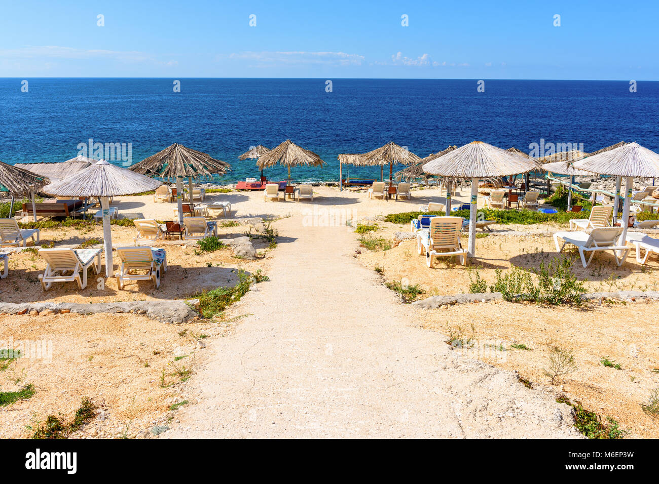 Sunbeds and parasol on Porto Roxa beach. Zakynthos island, Greece Stock ...