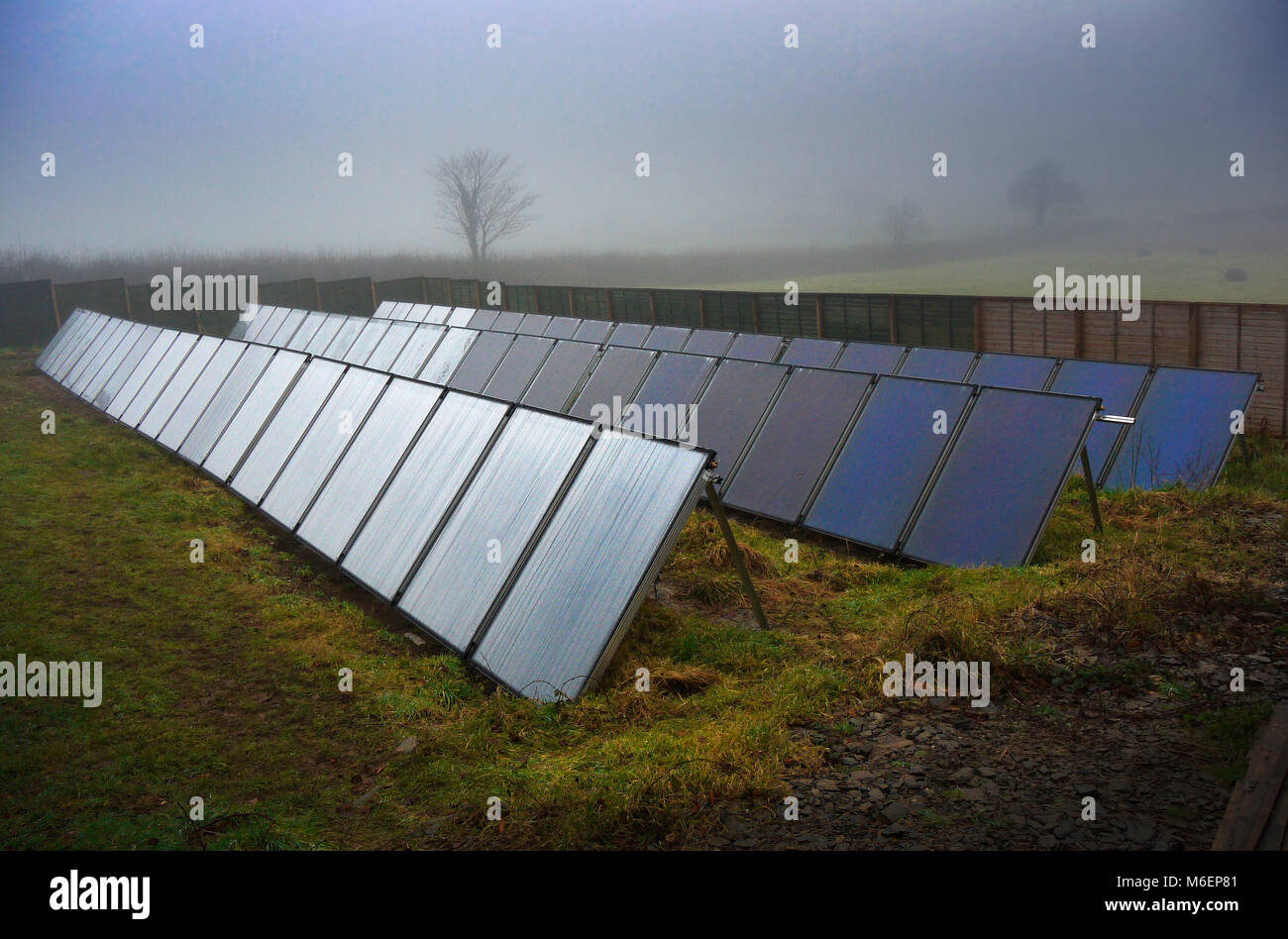 Devon, UK. Solar panels in the mist Stock Photo - Alamy