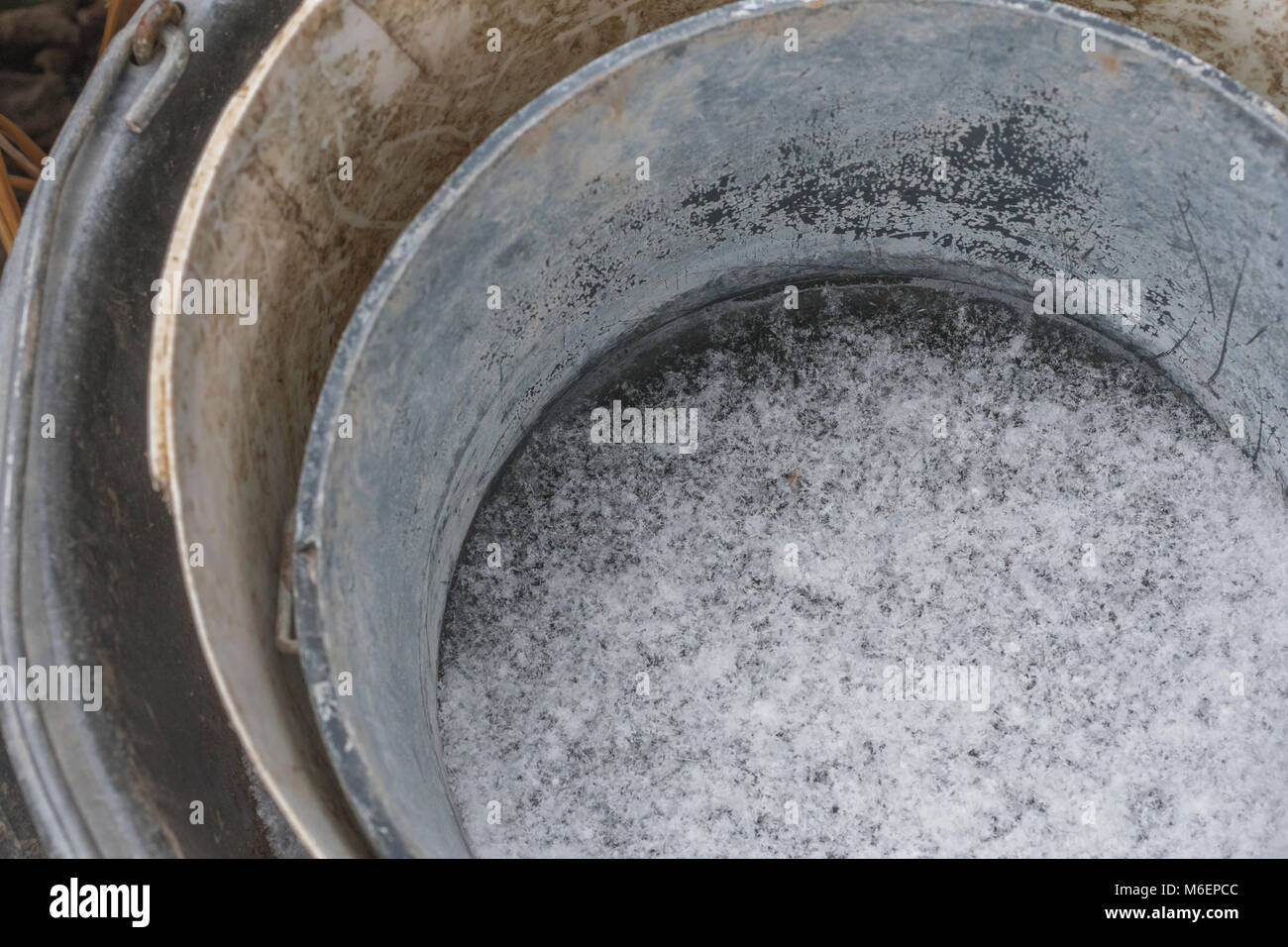 A set of builder's plastic work buckets stacked one inside another. The ...