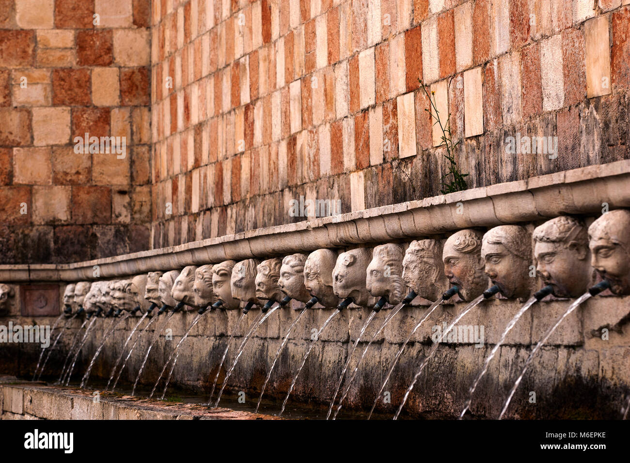 L'Aquila, Italy. Fountain of the 99 Water Spouts. 13th-century fountain ...