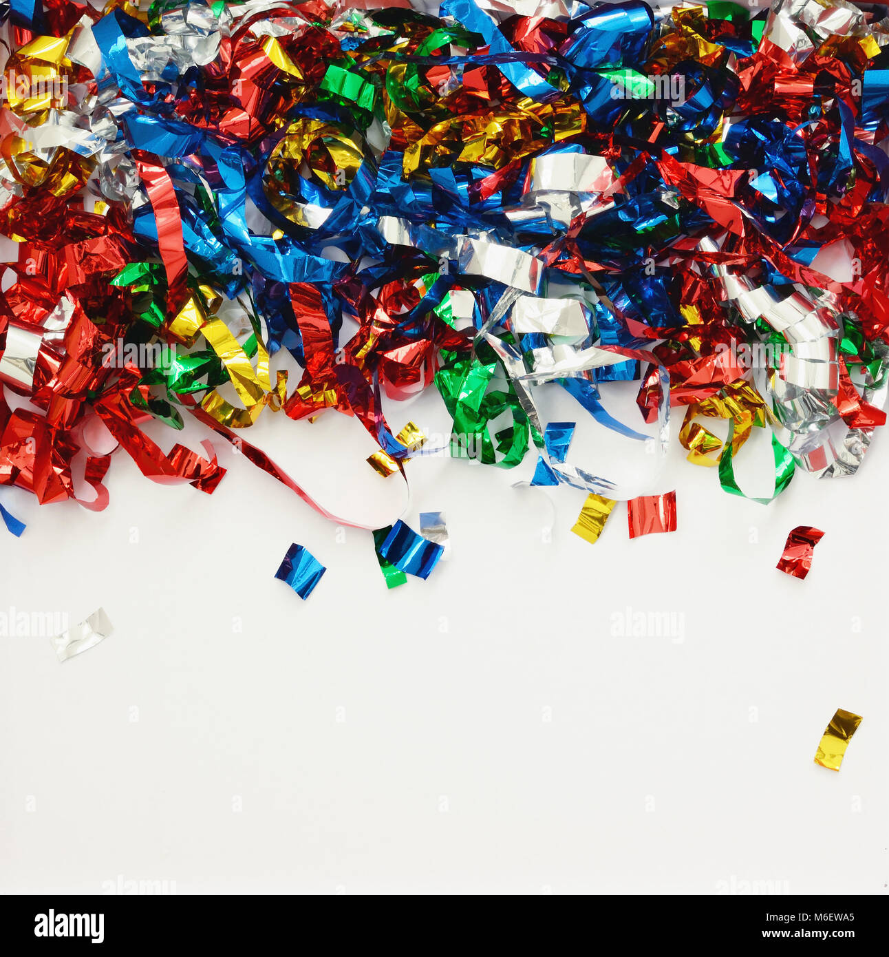 Background with scattered colorful confetti on white paper Stock Photo ...