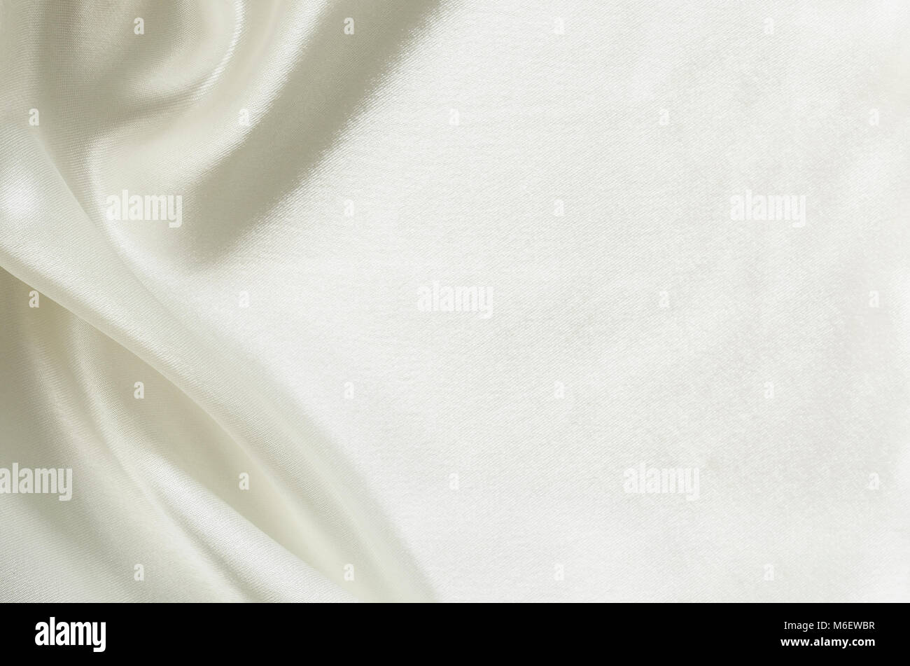 Closeup of white folded silk fabric for background Stock Photo - Alamy
