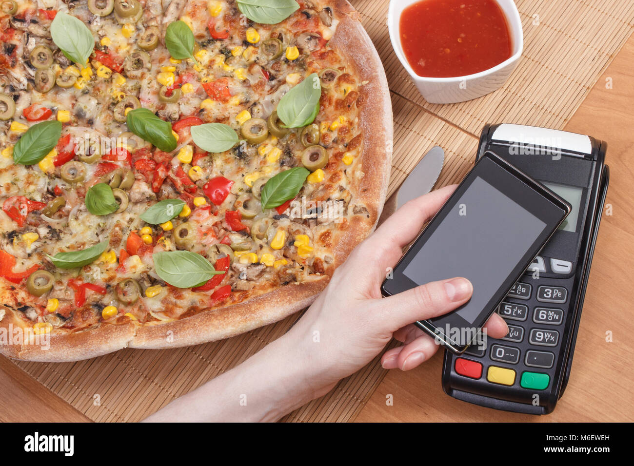 Using payment terminal and mobile phone with NFC technology, cashless ...