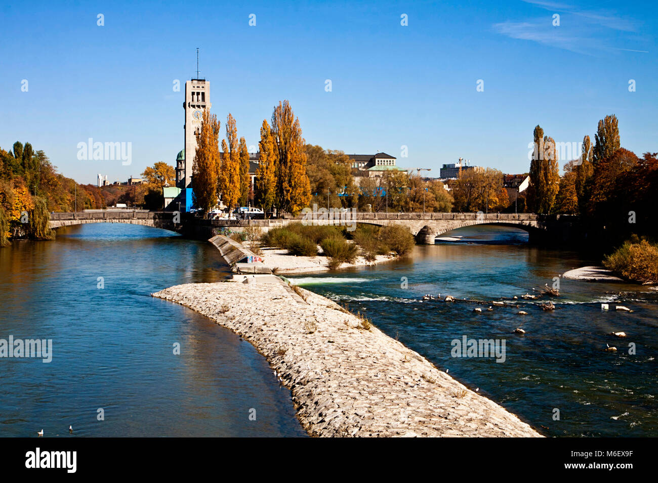 Beautiful autumnal view of the blue waters of Isar river in Munich ...