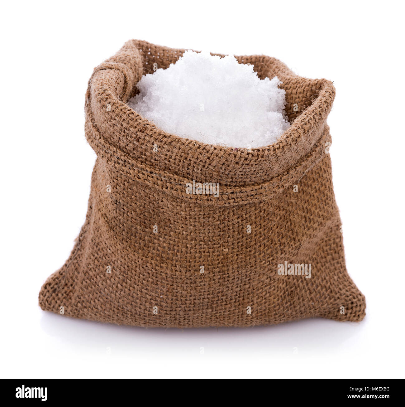 Sea salt in jute sack on white background Stock Photo - Alamy