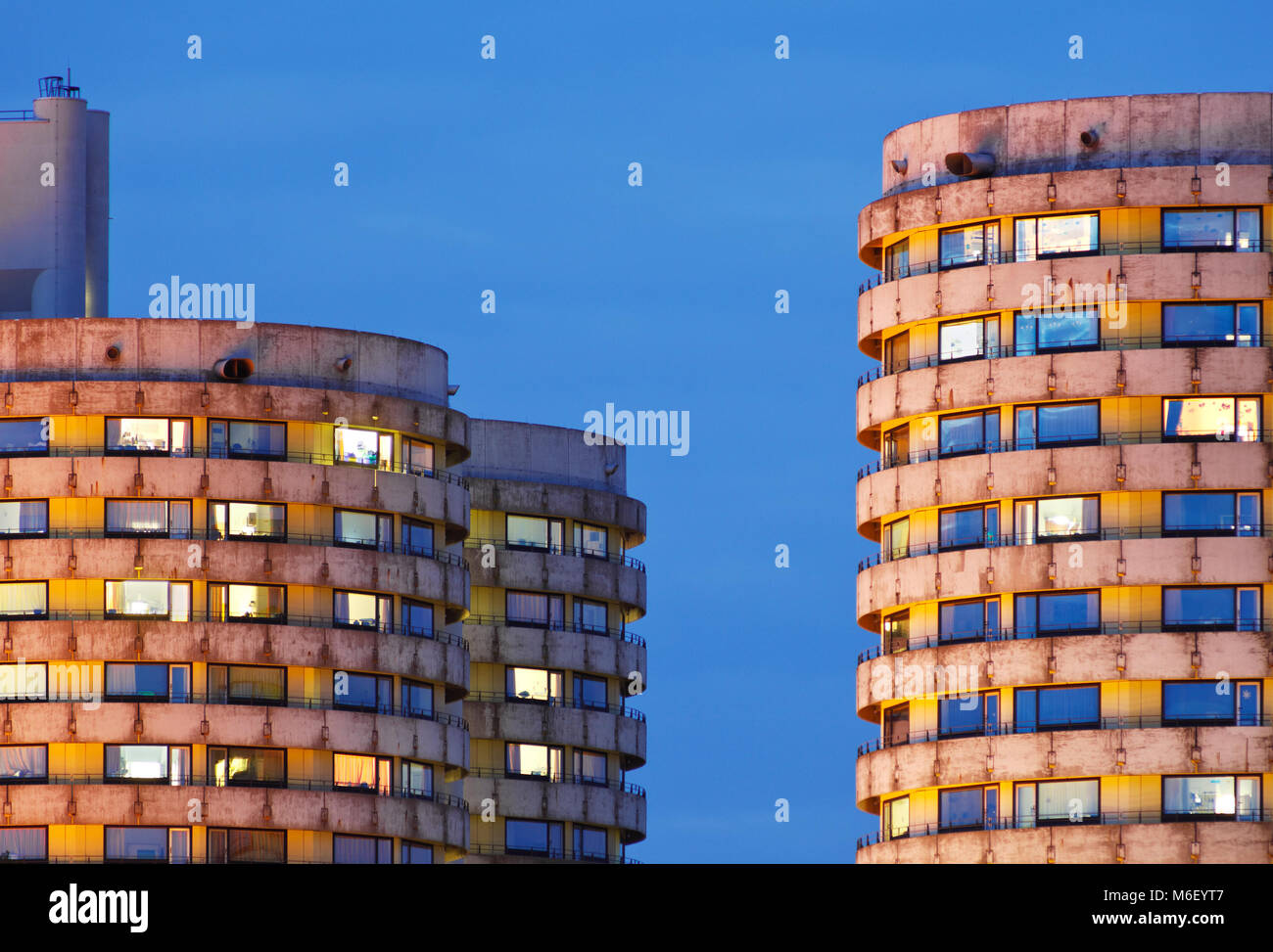 70s style hospital towers in the evening. Two tall tower buildings of a ...