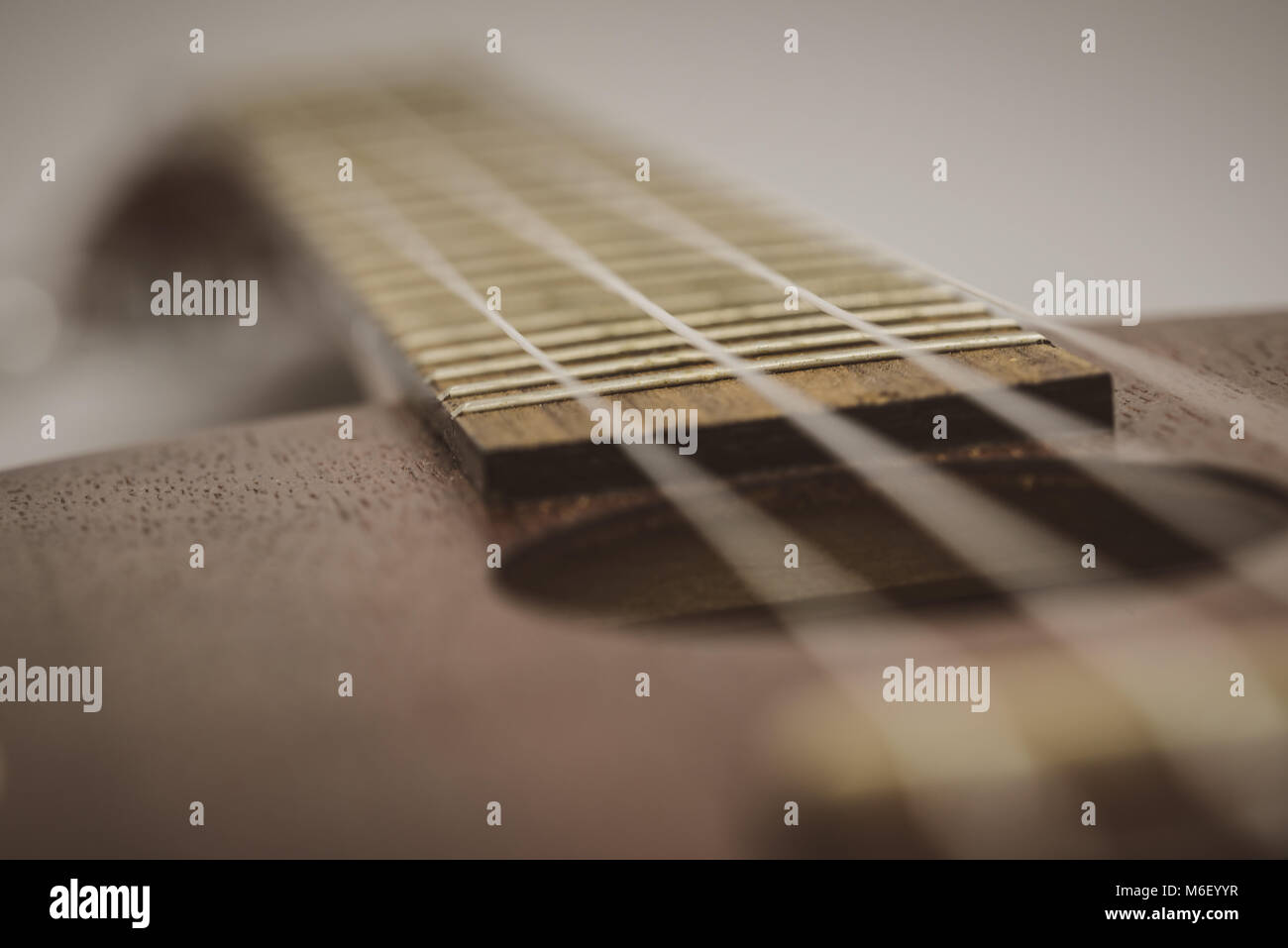 Ukulele body, neck and strings on white background Stock Photo - Alamy