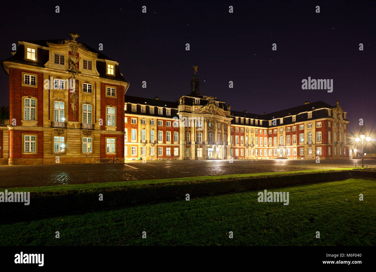 The large castle of Muenster, Germany at night which is also part of ...