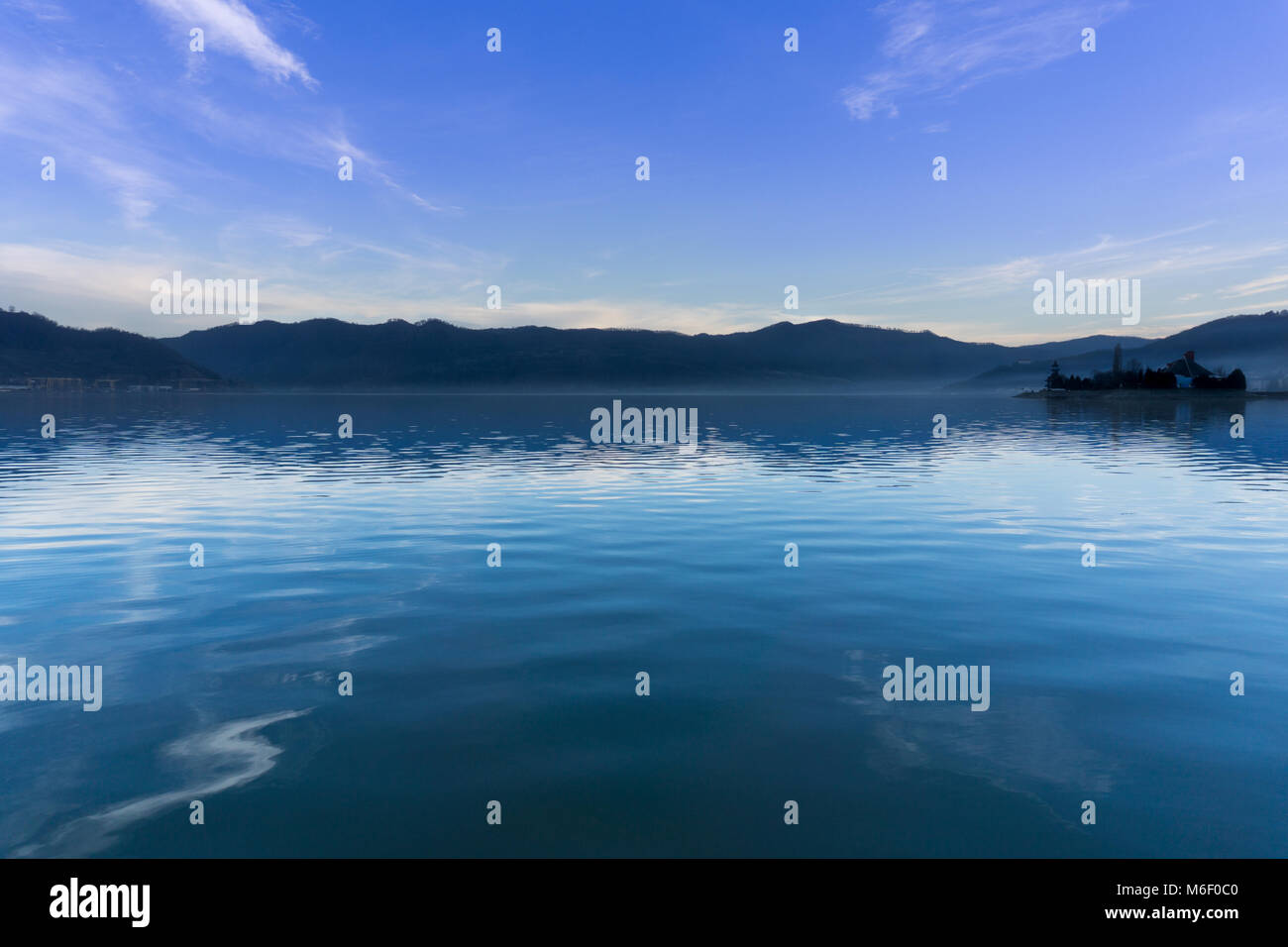 The blue Danube river as it flows past the small town of Orsova in ...