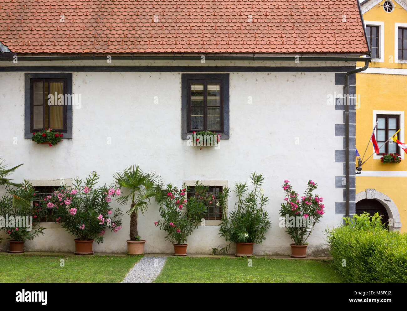 Facade of a flower decorated historic building in Slovenia Stock Photo ...