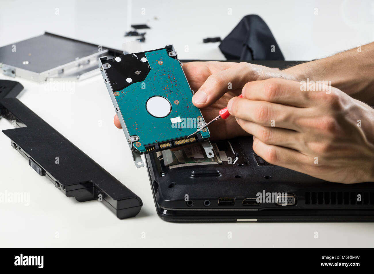 Cleaning old laptop PC Stock Photo - Alamy