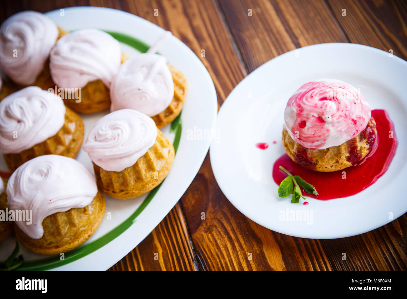 sweet muffins with berry cream Stock Photo - Alamy