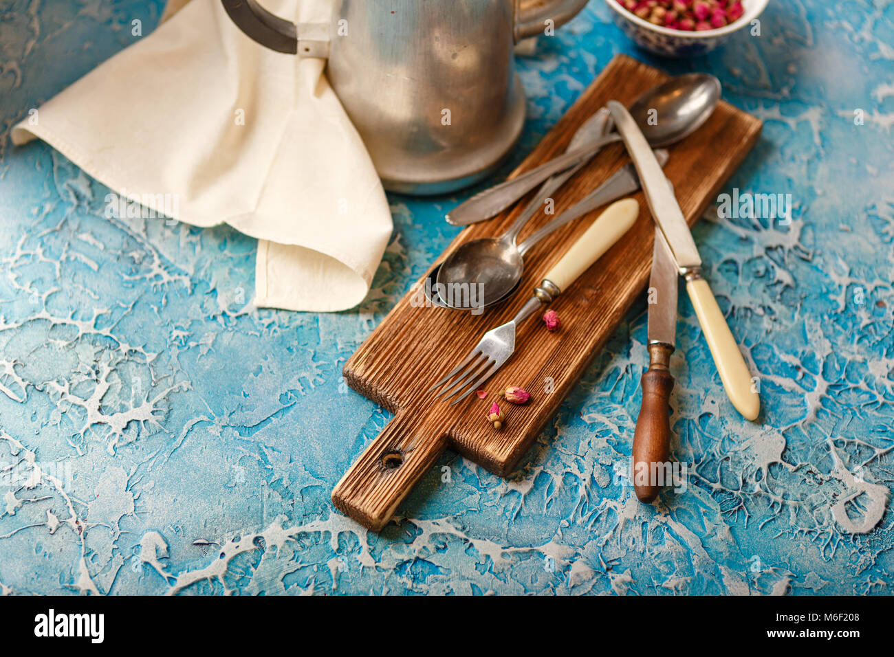 Various kitchen utensils cutlery on blue background Stock Photo - Alamy