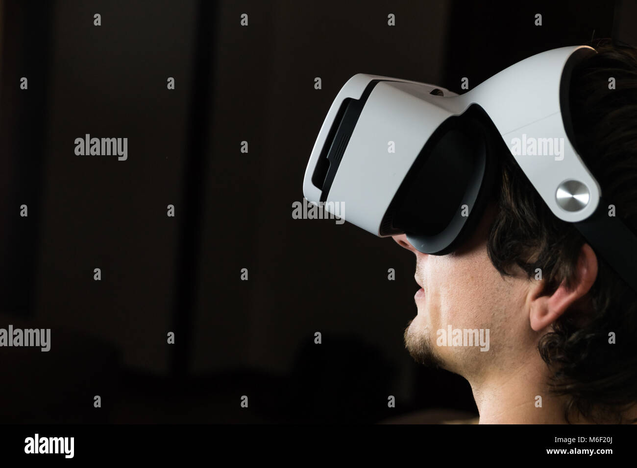 Person in virtual reality headset Stock Photo - Alamy