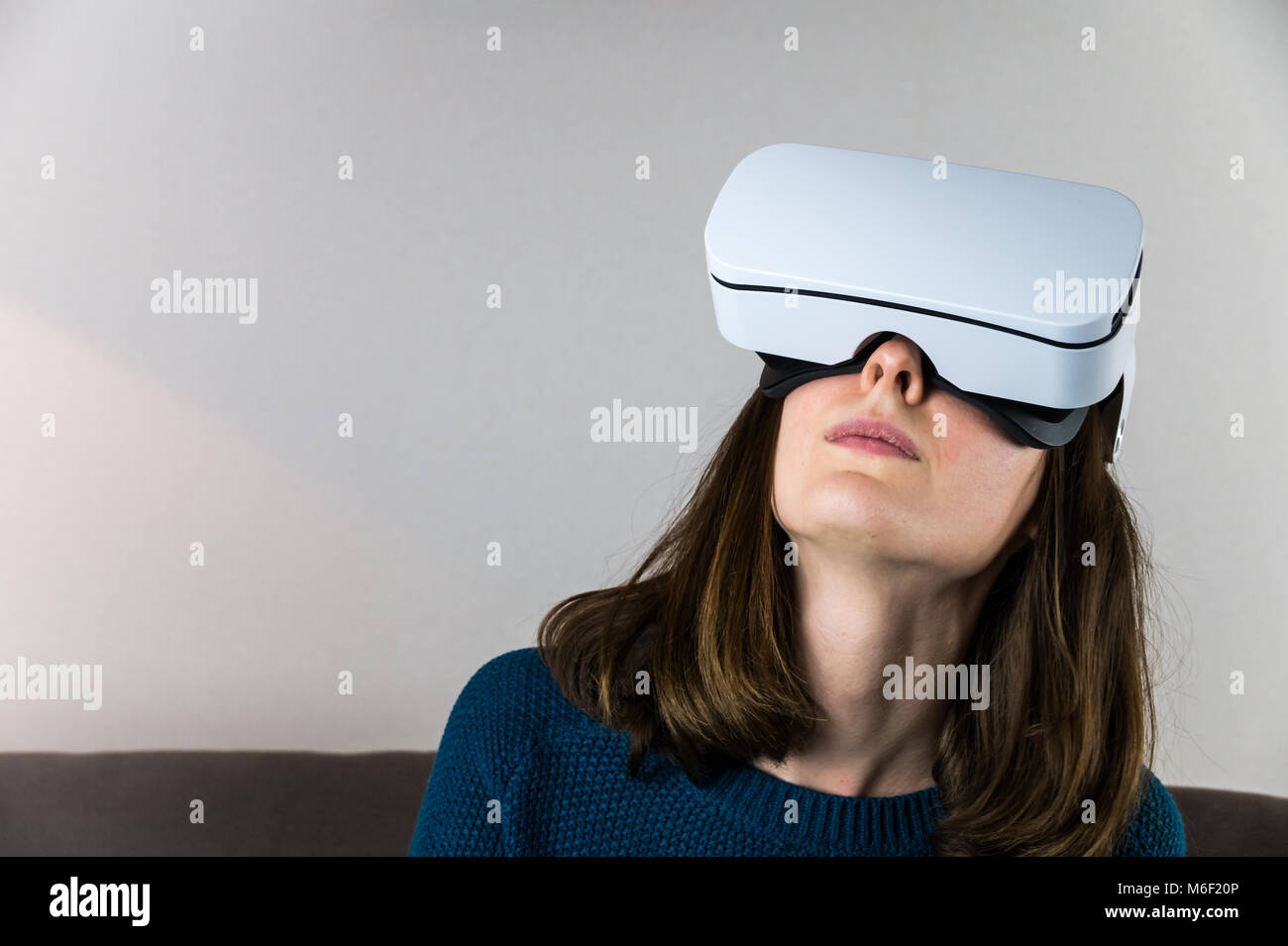 Exploring virtual reality in vr box Stock Photo - Alamy