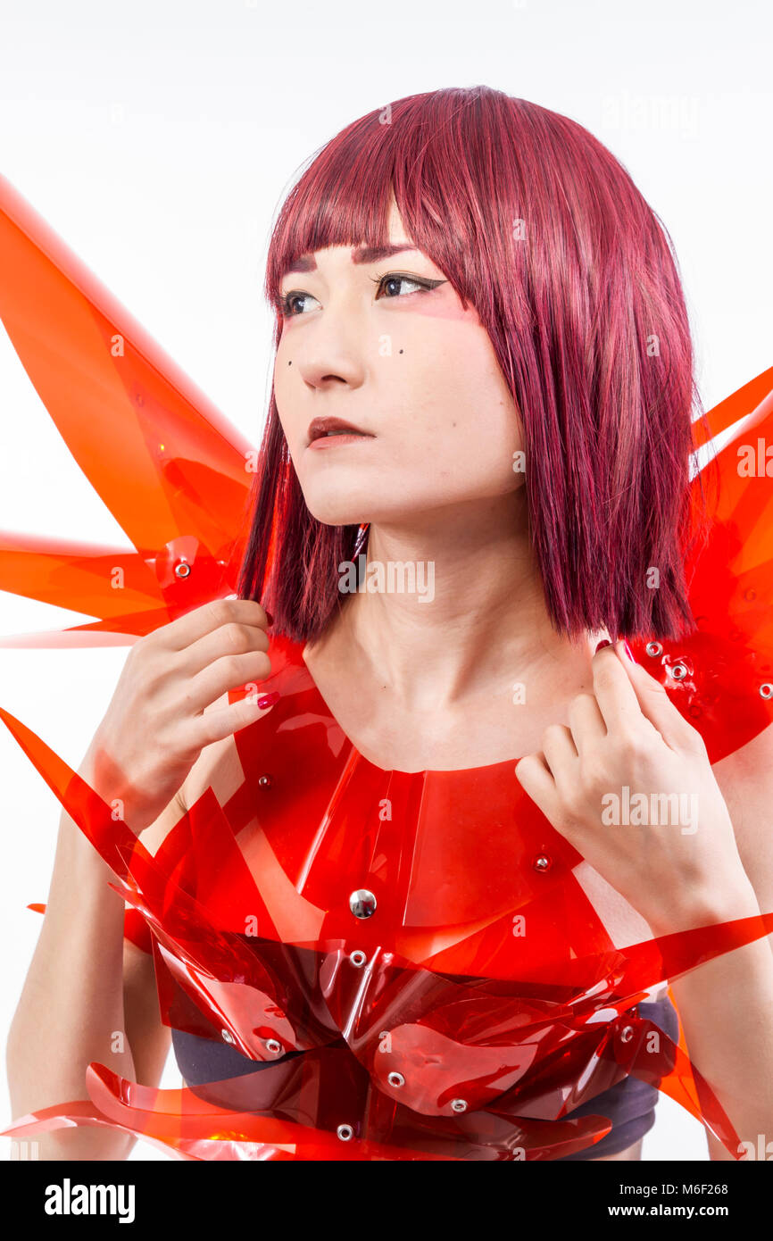 Cosplay, Asian woman cosplayer with futuristic costume in red, made ...