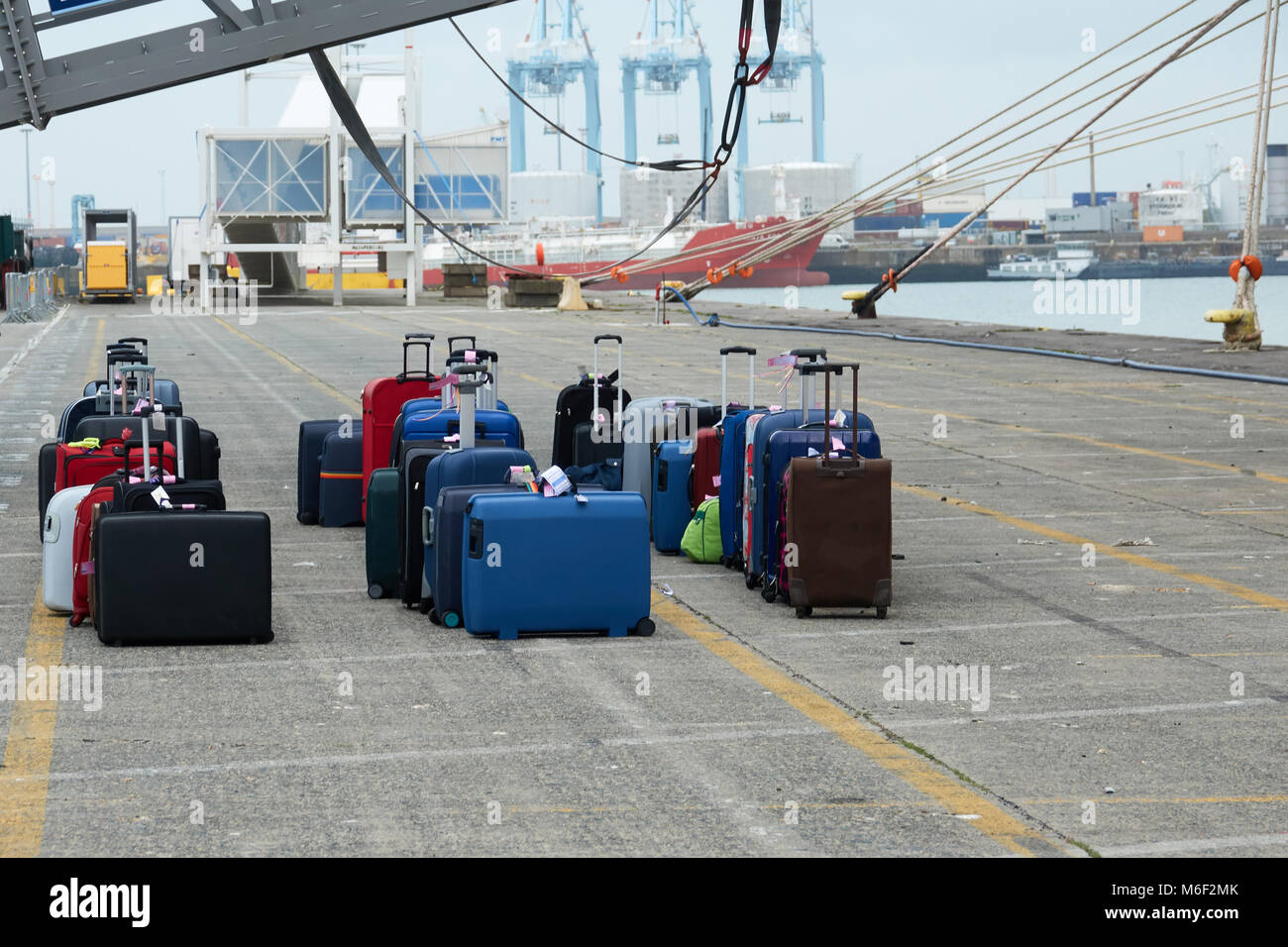 Suitcases of tourists of the sea liner at the unloading in the seaport ...